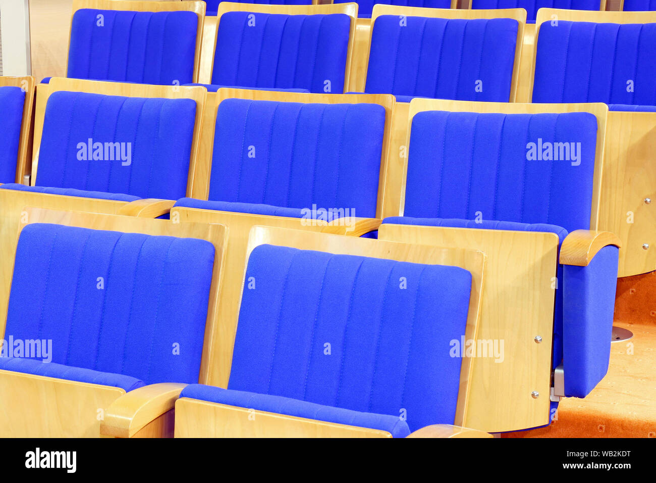 Cinema chairs in rows with blue textile Stock Photo - Alamy