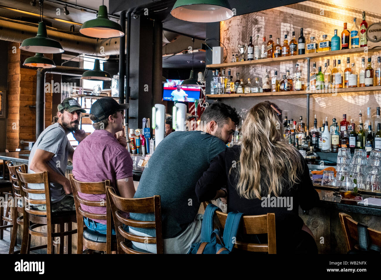 Guys having lunch in a pub, Toronto Stock Photo - Alamy