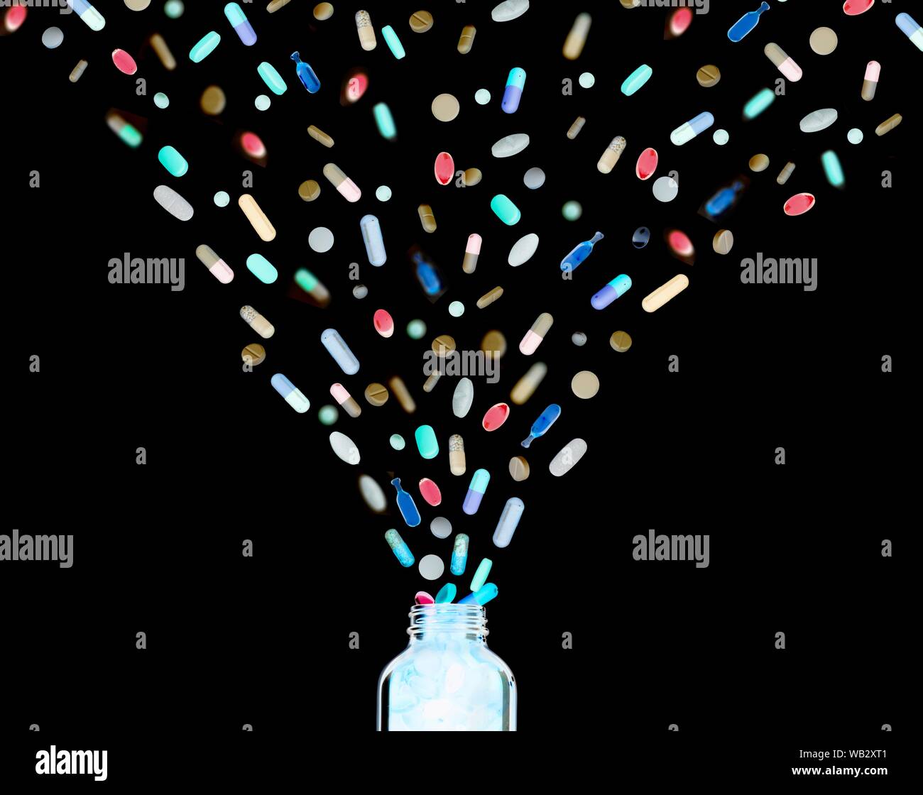 Assortment of pills, tablets and capsules pouring from bottle Stock ...