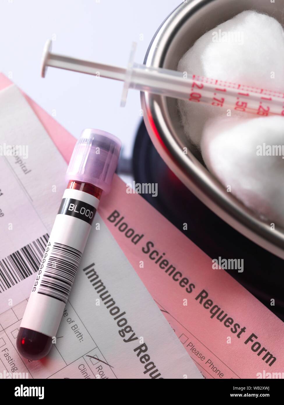 Human blood sample alongside blood test request form Stock Photo - Alamy