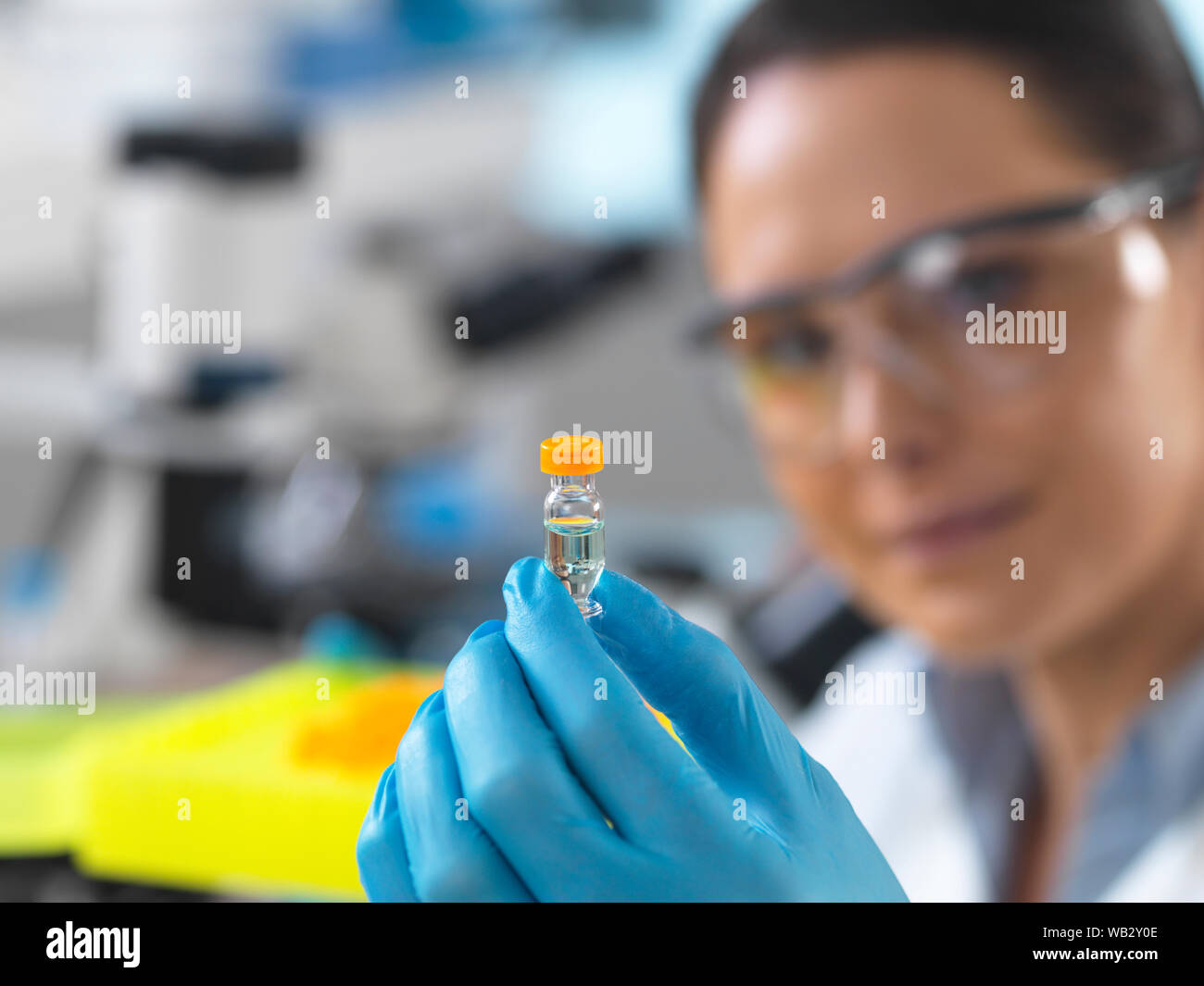 Biotechnology research. Scientist examining sample in a test tube ready ...