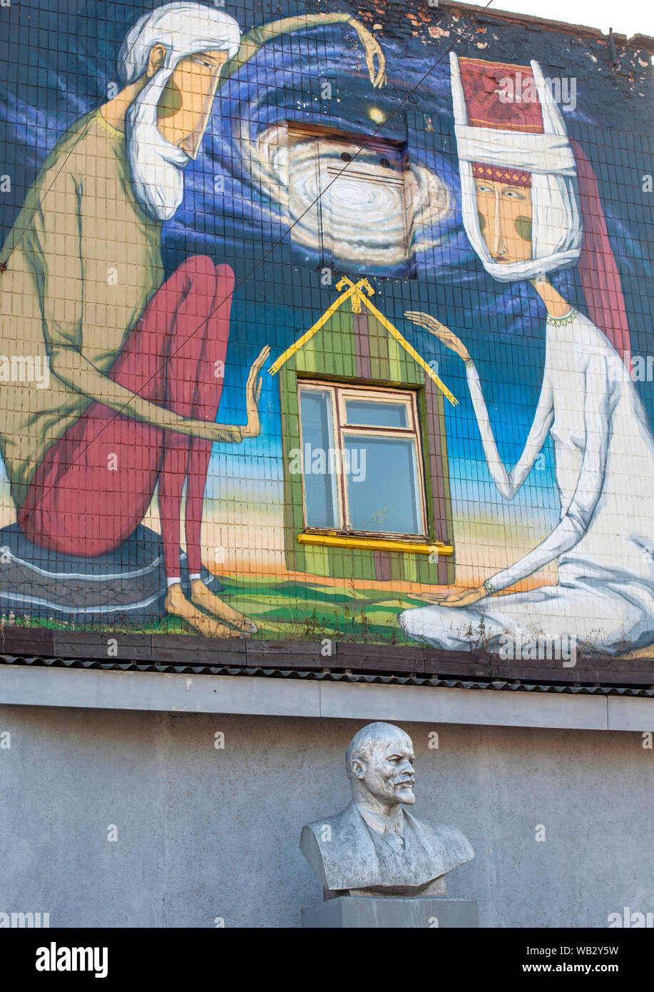 A bust of Lenin against a background of graffiti street art on a ...