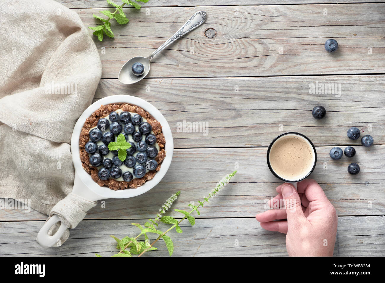 Flat lay of delicious Blueberry tartlets with vanilla custard cream ...