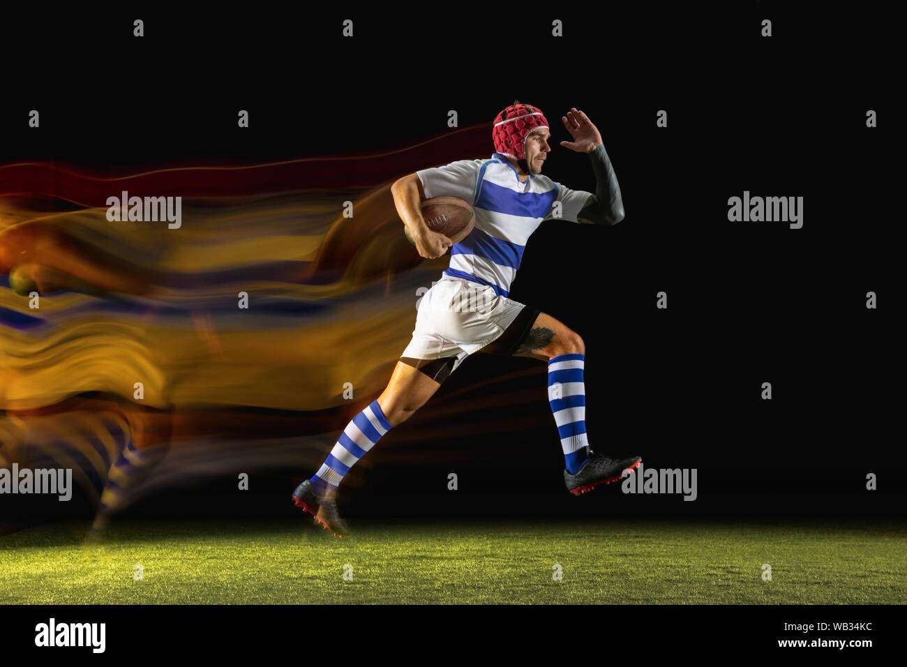 Ready for winning. One caucasian man playing rugby on the stadium in ...