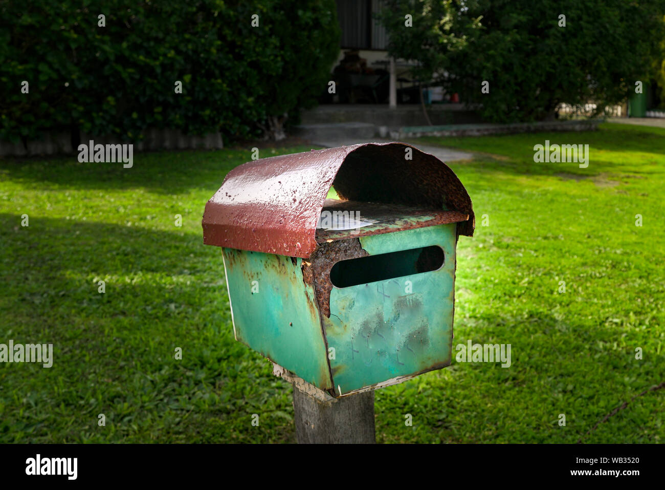 Old rusty letter box or post outside house Stock Photo - Alamy