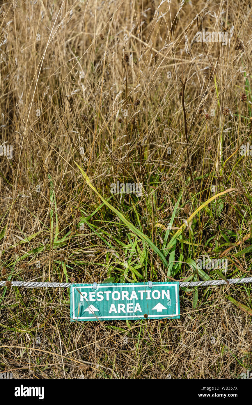 Natural grassland habitat restoration green and white notice and ...