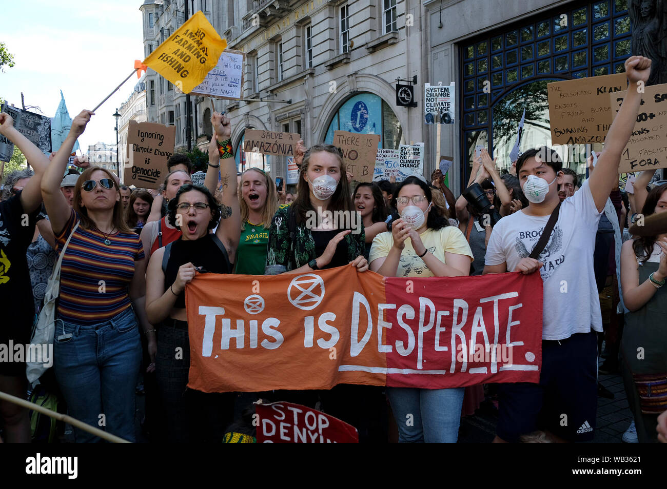 London, UK. 23rd Aug, 2019. Environmental activists are seen shouting ...