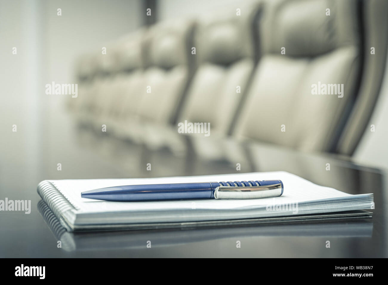 Business concept with paper agenda and pen in meeting room Stock Photo ...