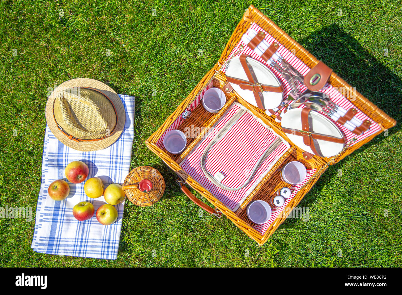 Flat lay view of Picnic basket with food on green sunny lawn Stock ...