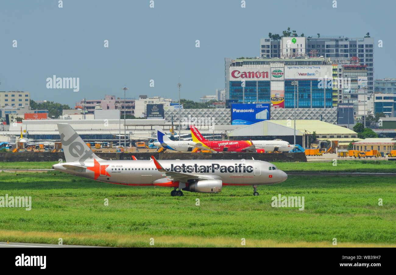 Saigon, Vietnam - Jun 19, 2019. Passenger airplanes taxiing on runway ...
