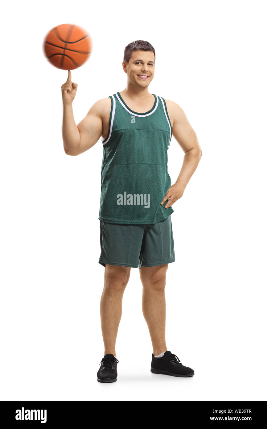 Full length portrait of a basketball player standing and spinning a ...
