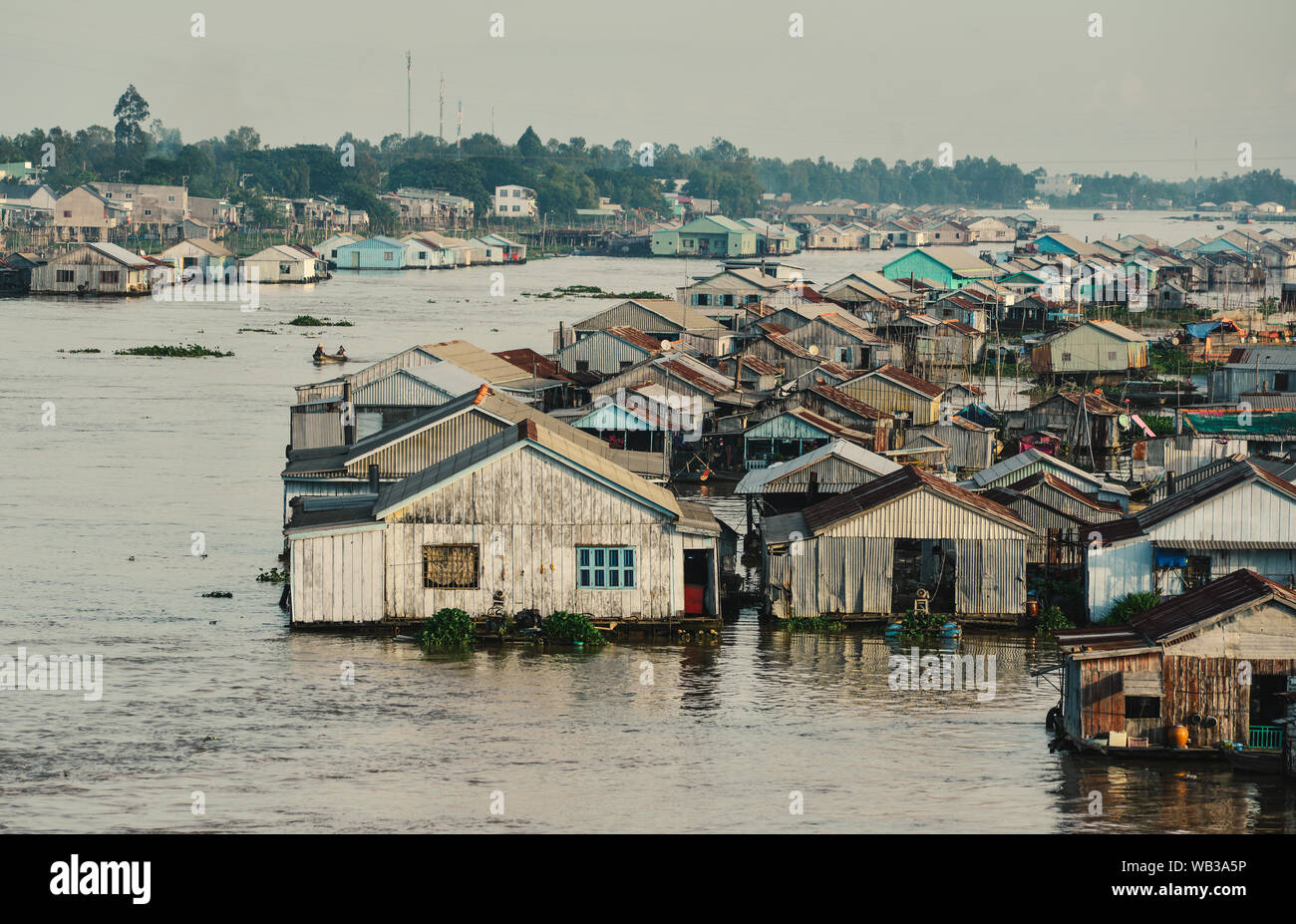 Floating houses on Mekong River in Chau Doc, Vietnam. Chau Doc is a ...