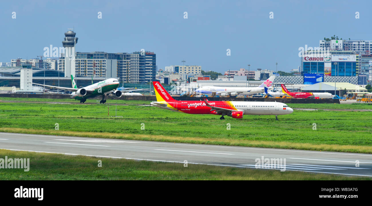 Saigon, Vietnam - Jun 19, 2019. Passenger airplanes taxiing on runway ...