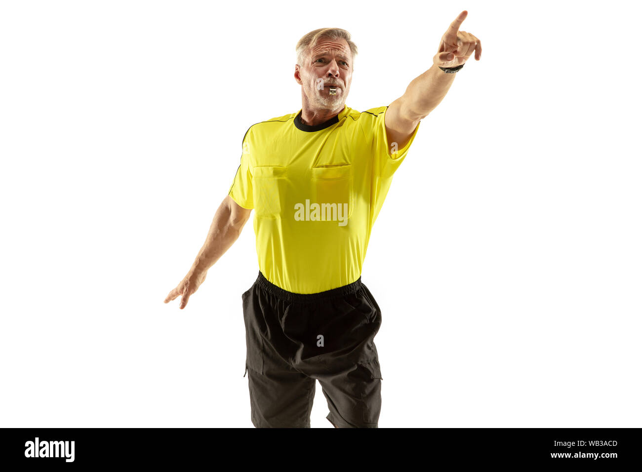 Referee gives directions with gestures to football or soccer players ...