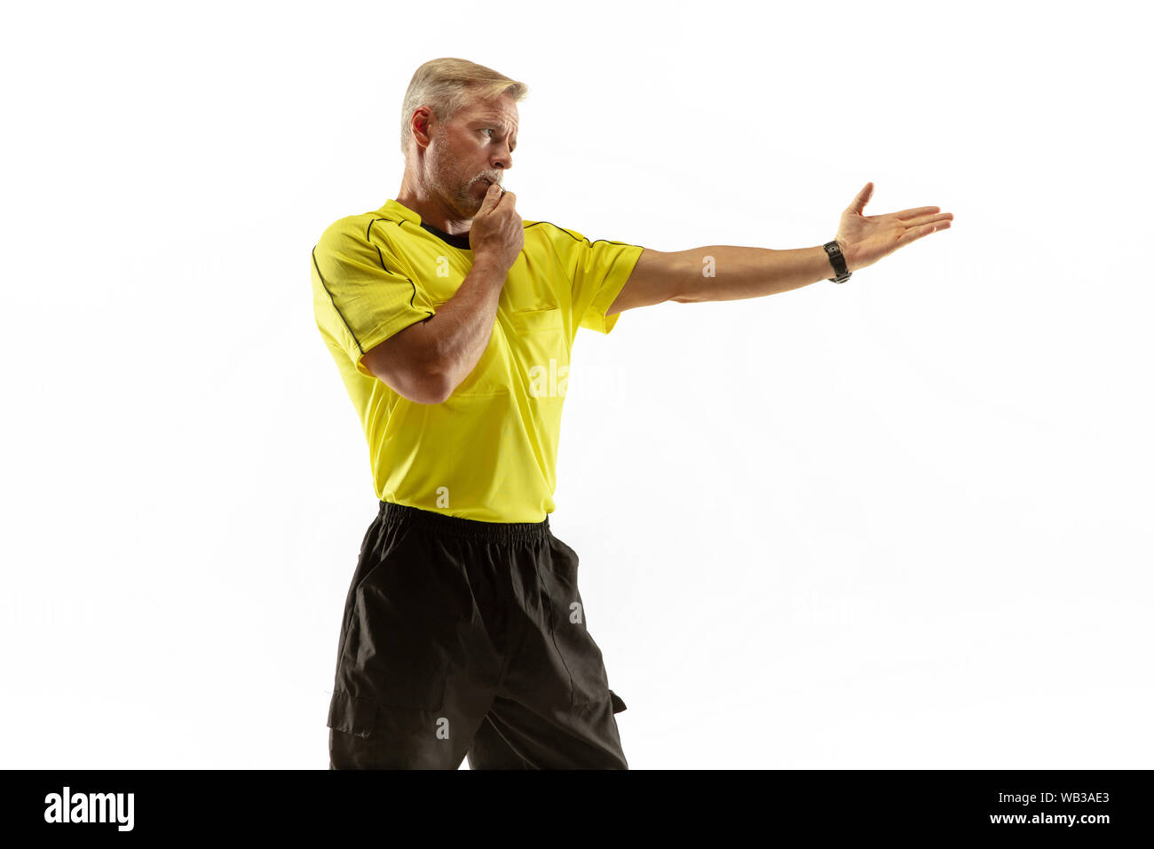 Referee gives directions with gestures to football or soccer players ...