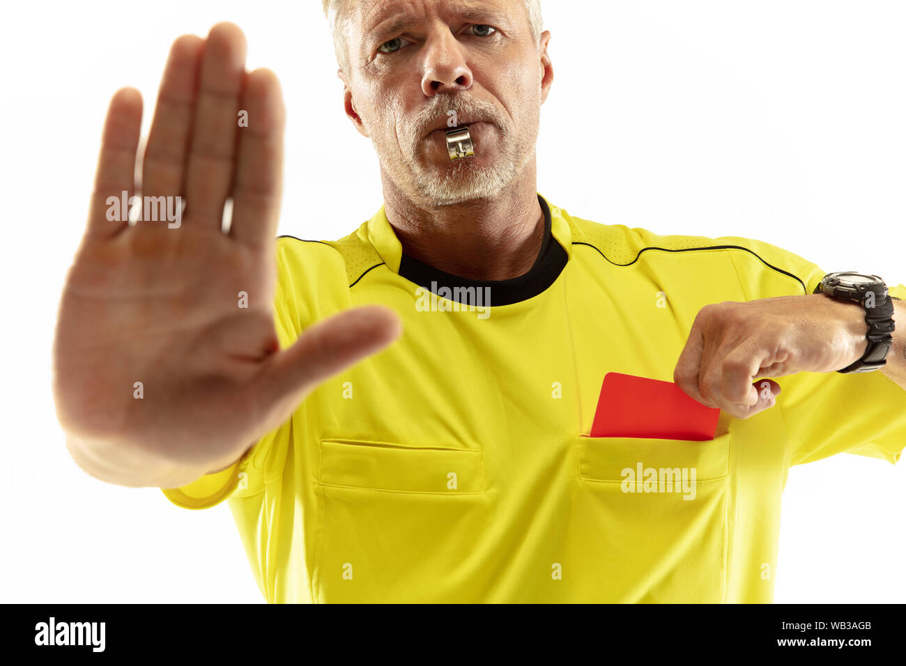 Referee showing a red card to a displeased football or soccer player ...