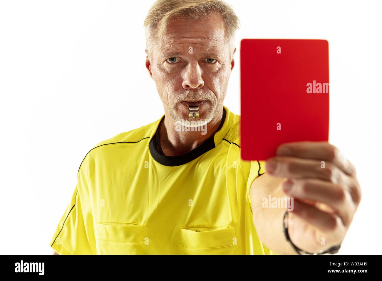 Referee showing a red card to a displeased football or soccer player ...