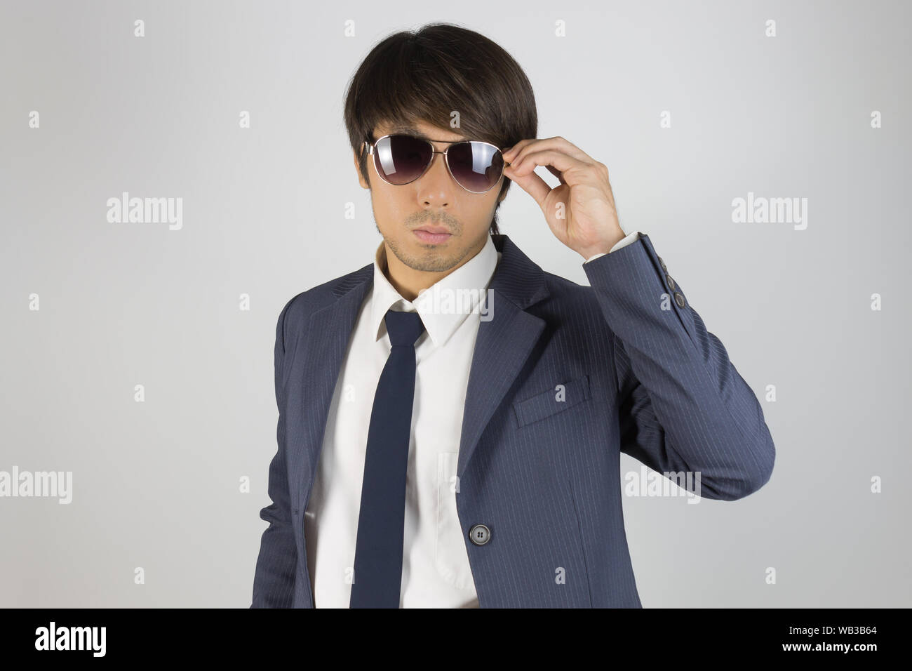 Young Asian Portrait Businessman in Navy Blue Suit Touch Sunglasses in ...