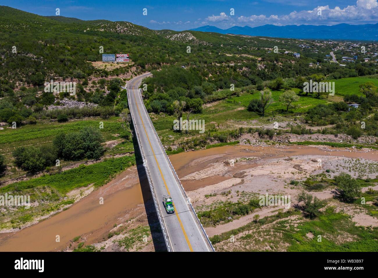 Aerial view of the bridge and road that crosses the river. Entry and ...