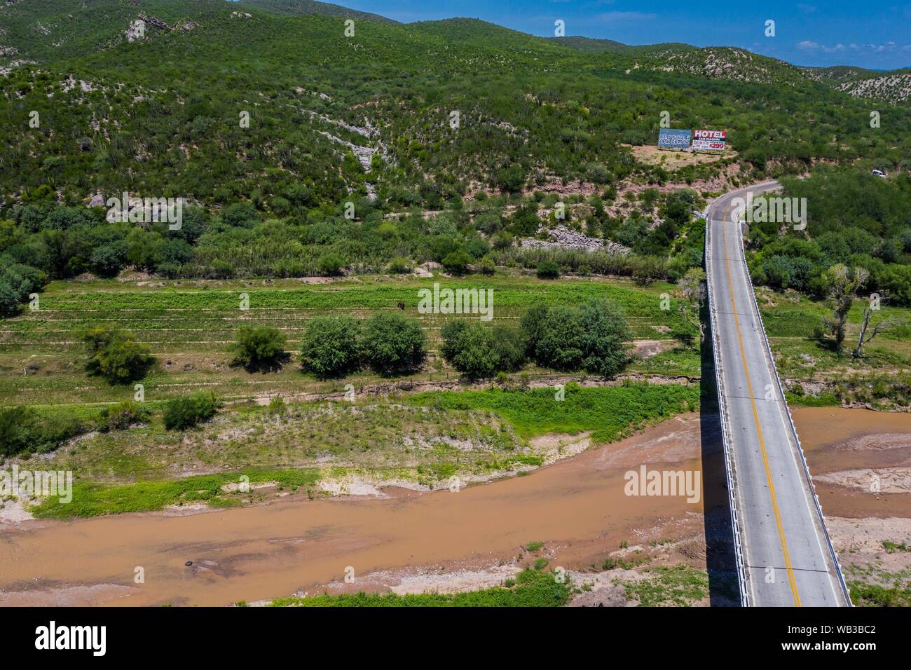Aerial view of the bridge and road that crosses the river. Entry and ...