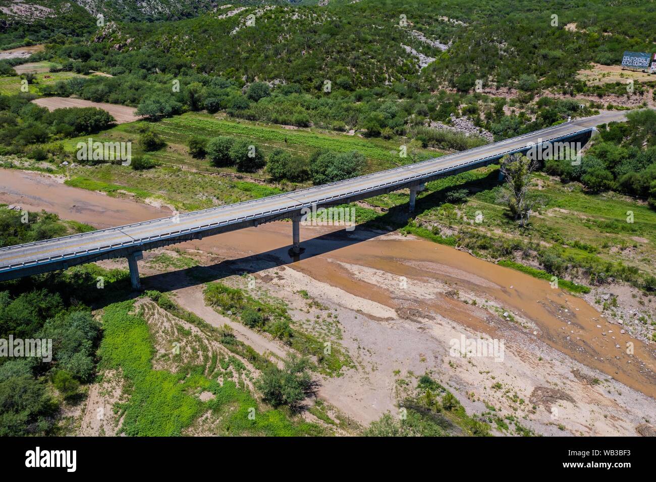 Aerial view of the bridge and road that crosses the river. Entry and ...