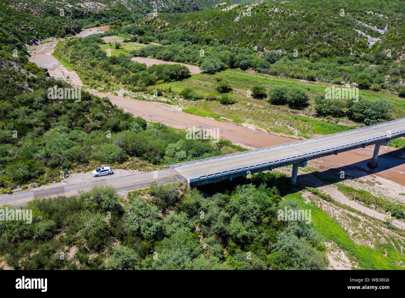 Aerial view of the bridge and road that crosses the river. Entry and ...