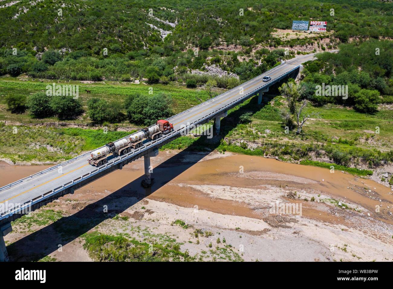 Aerial view of the bridge and road that crosses the river. Entry and ...