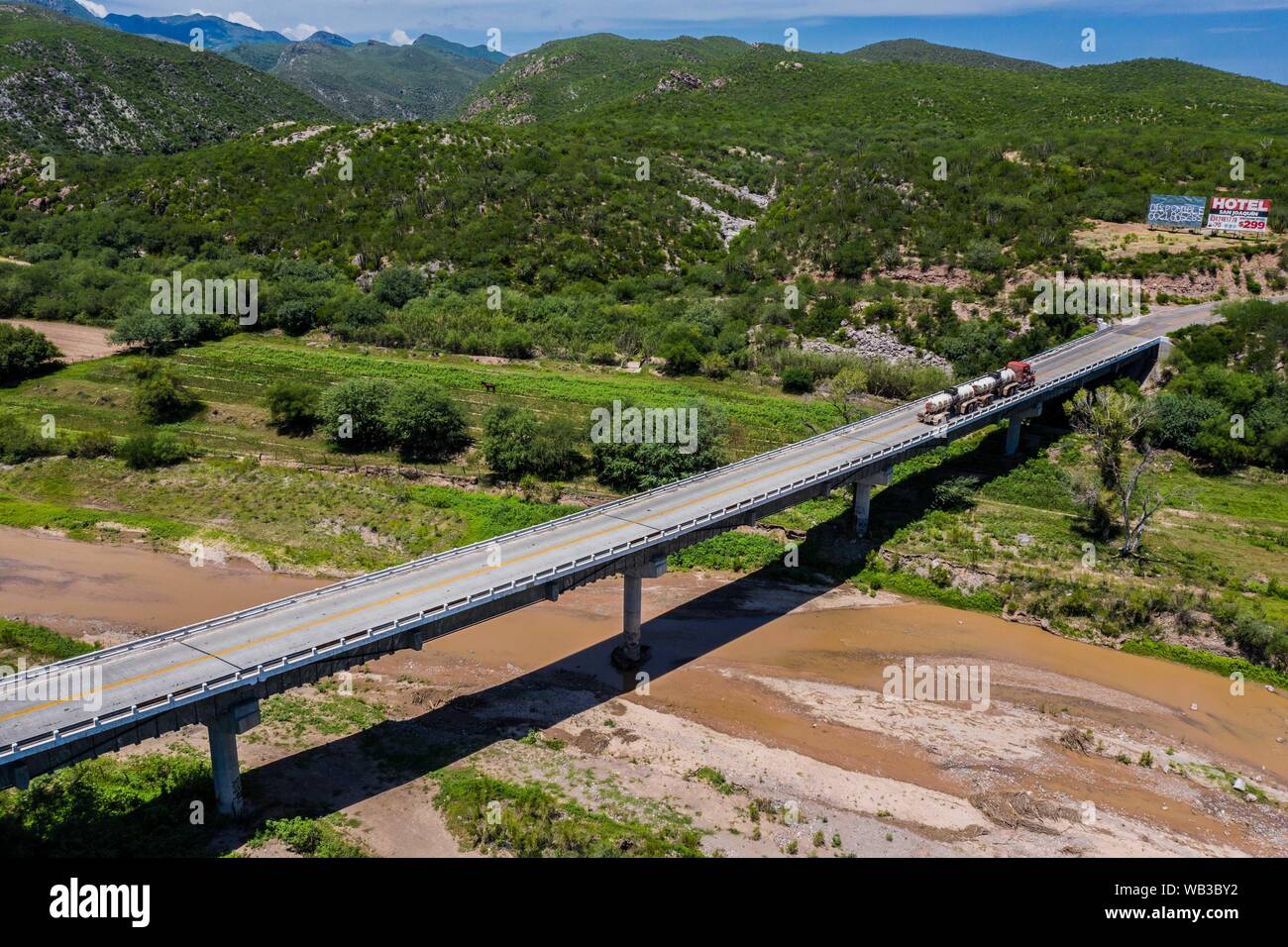 Aerial view of the bridge and road that crosses the river. Entry and ...