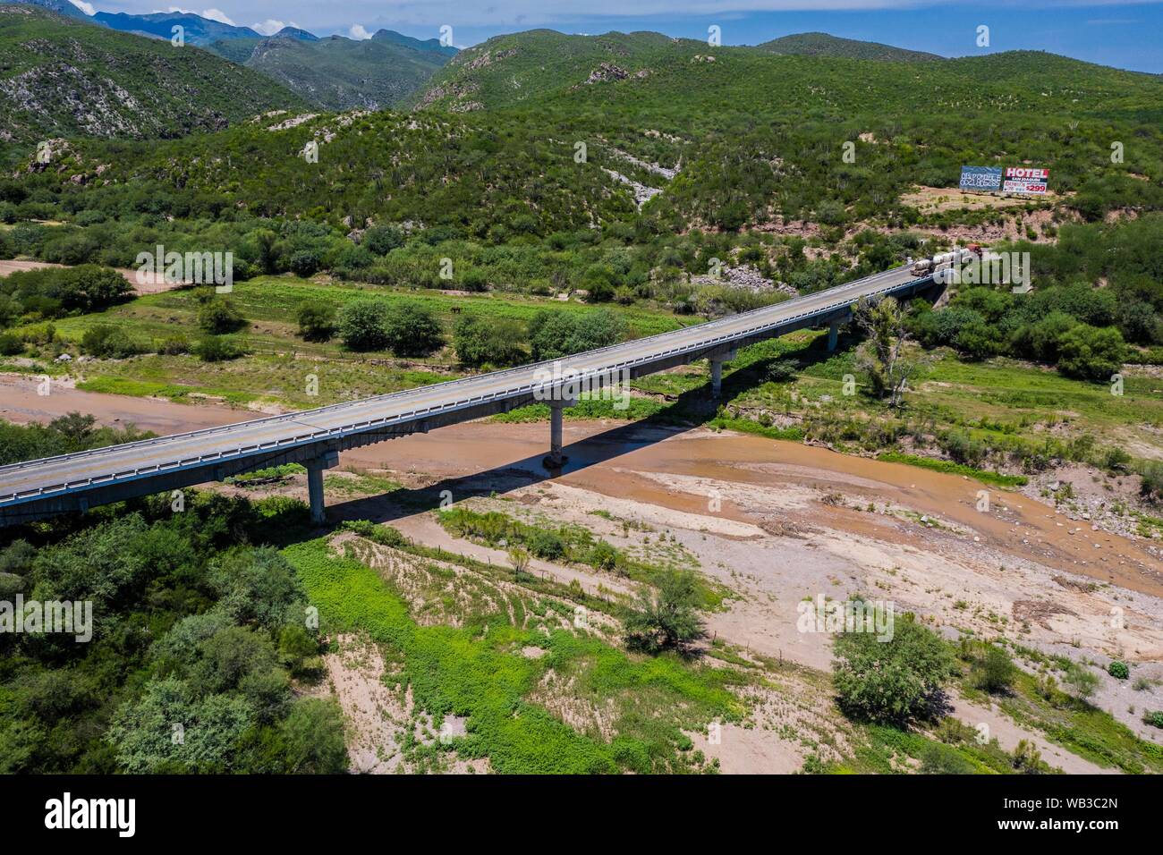 Aerial view of the bridge and road that crosses the river. Entry and ...