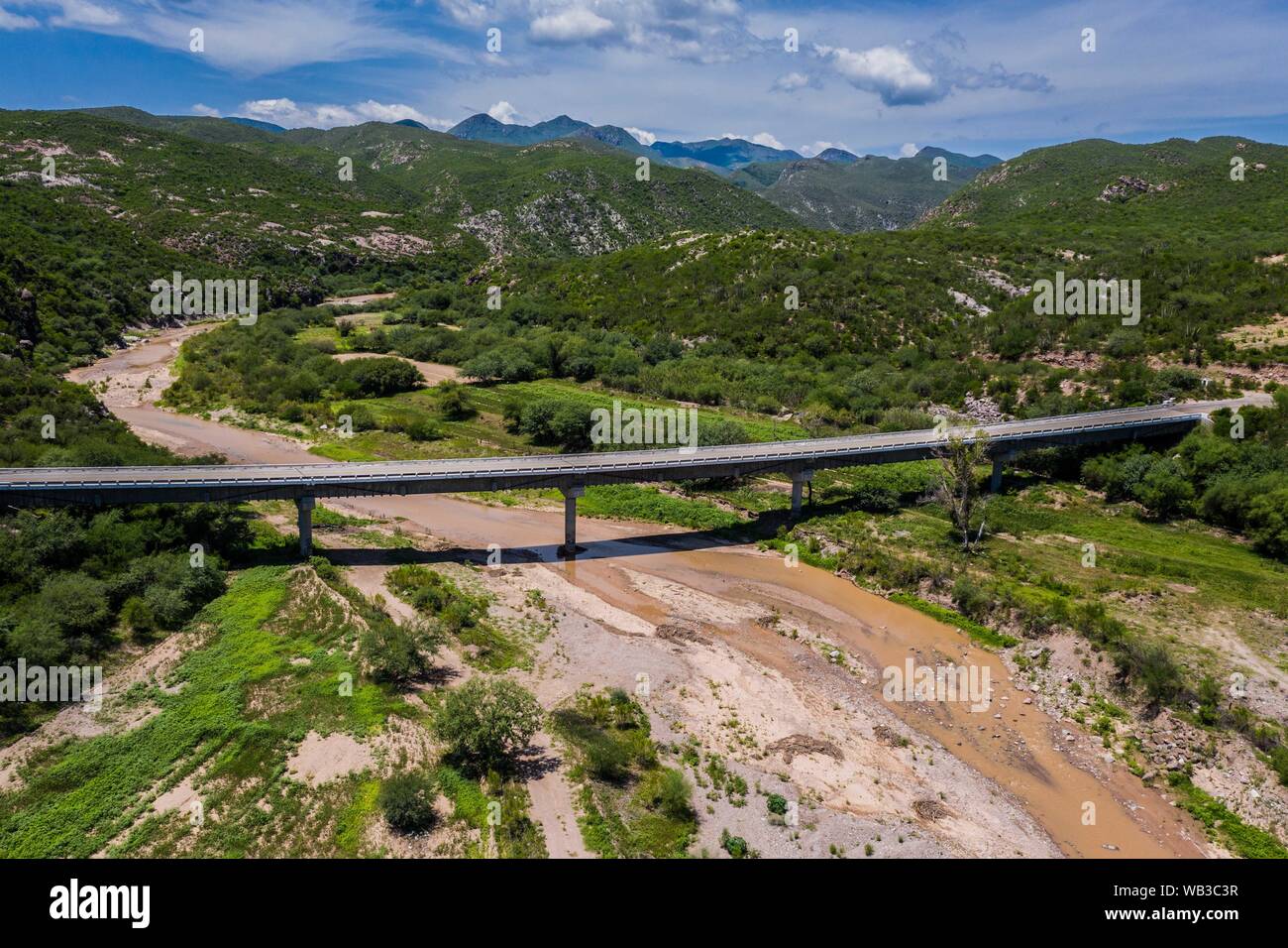 Aerial view of the bridge and road that crosses the river. Entry and ...