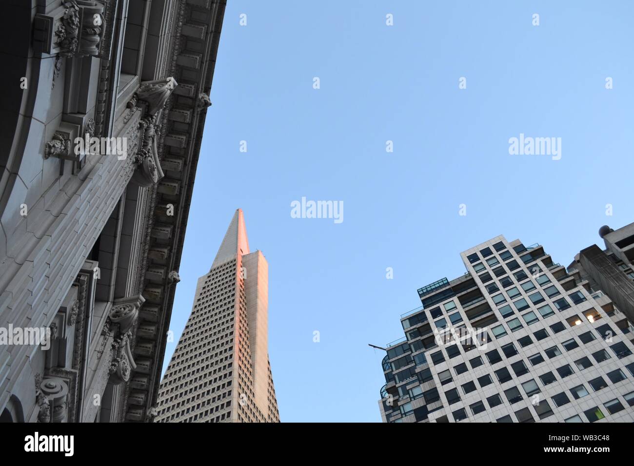 shot of an old historical building near contemporary abstract ...