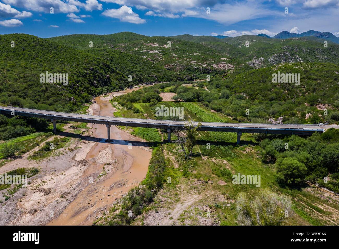 Aerial view of the bridge and road that crosses the river. Entry and ...