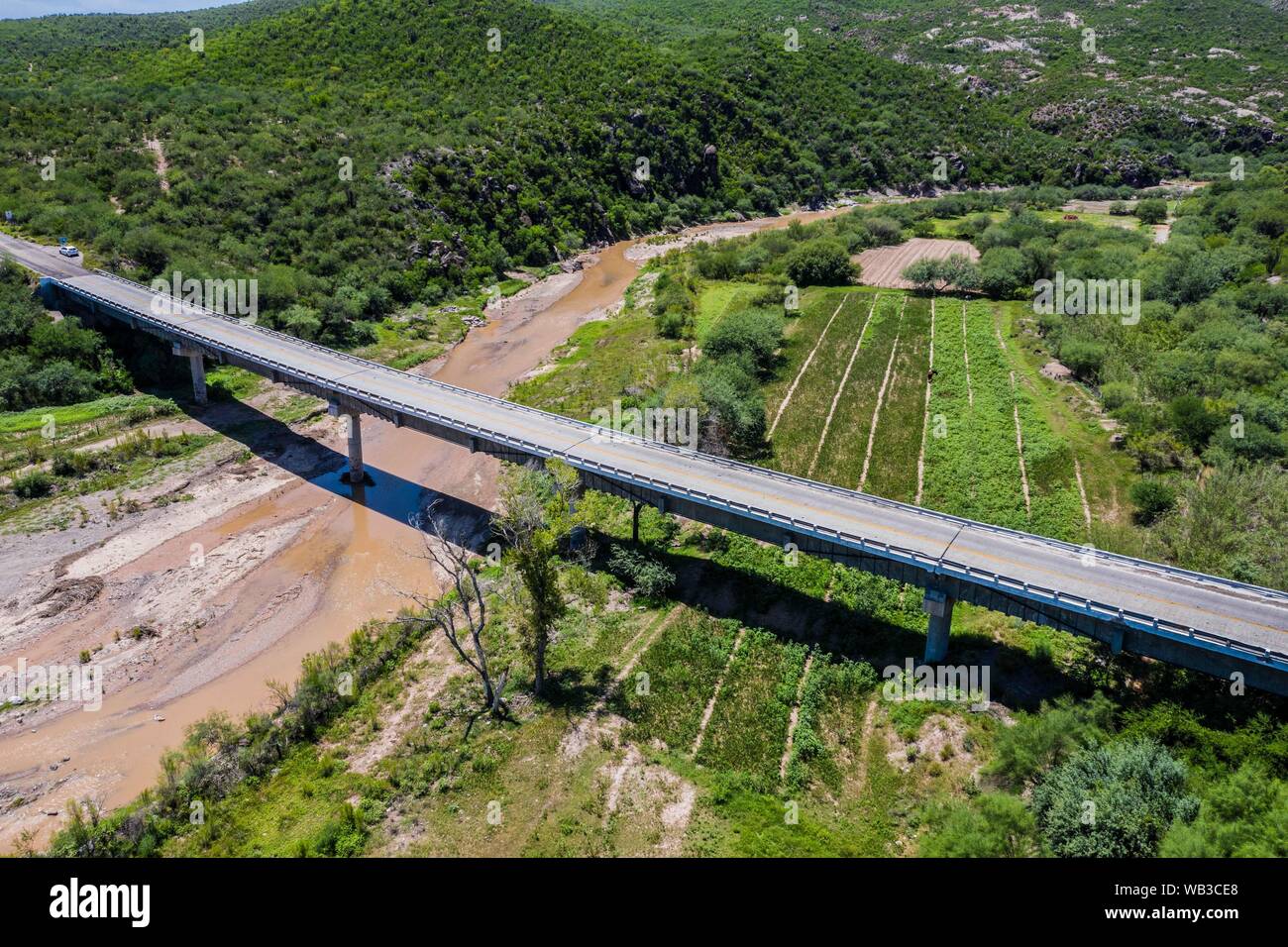 Aerial view of the bridge and road that crosses the river. Entry and ...