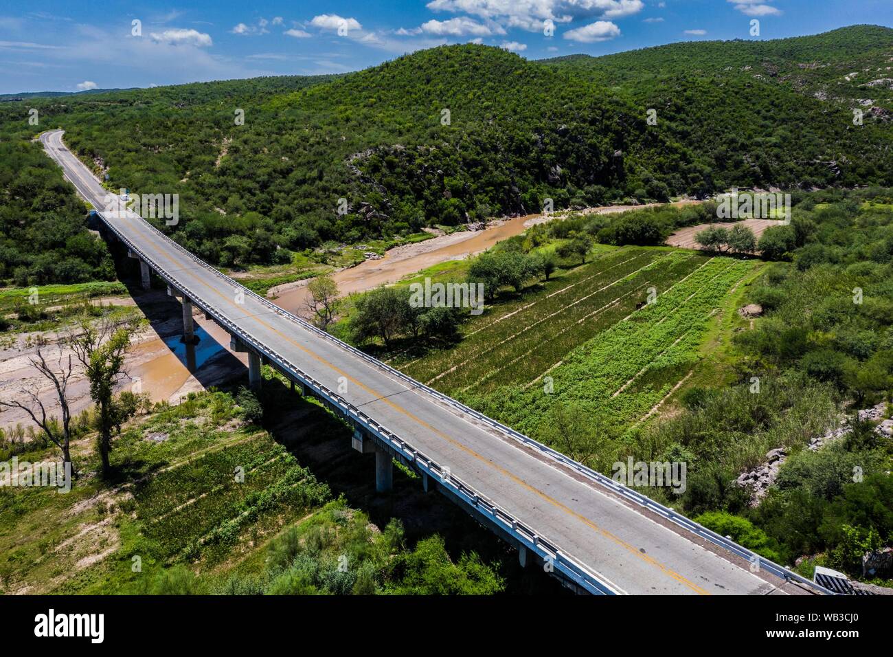 Aerial view of the bridge and road that crosses the river. Entry and ...