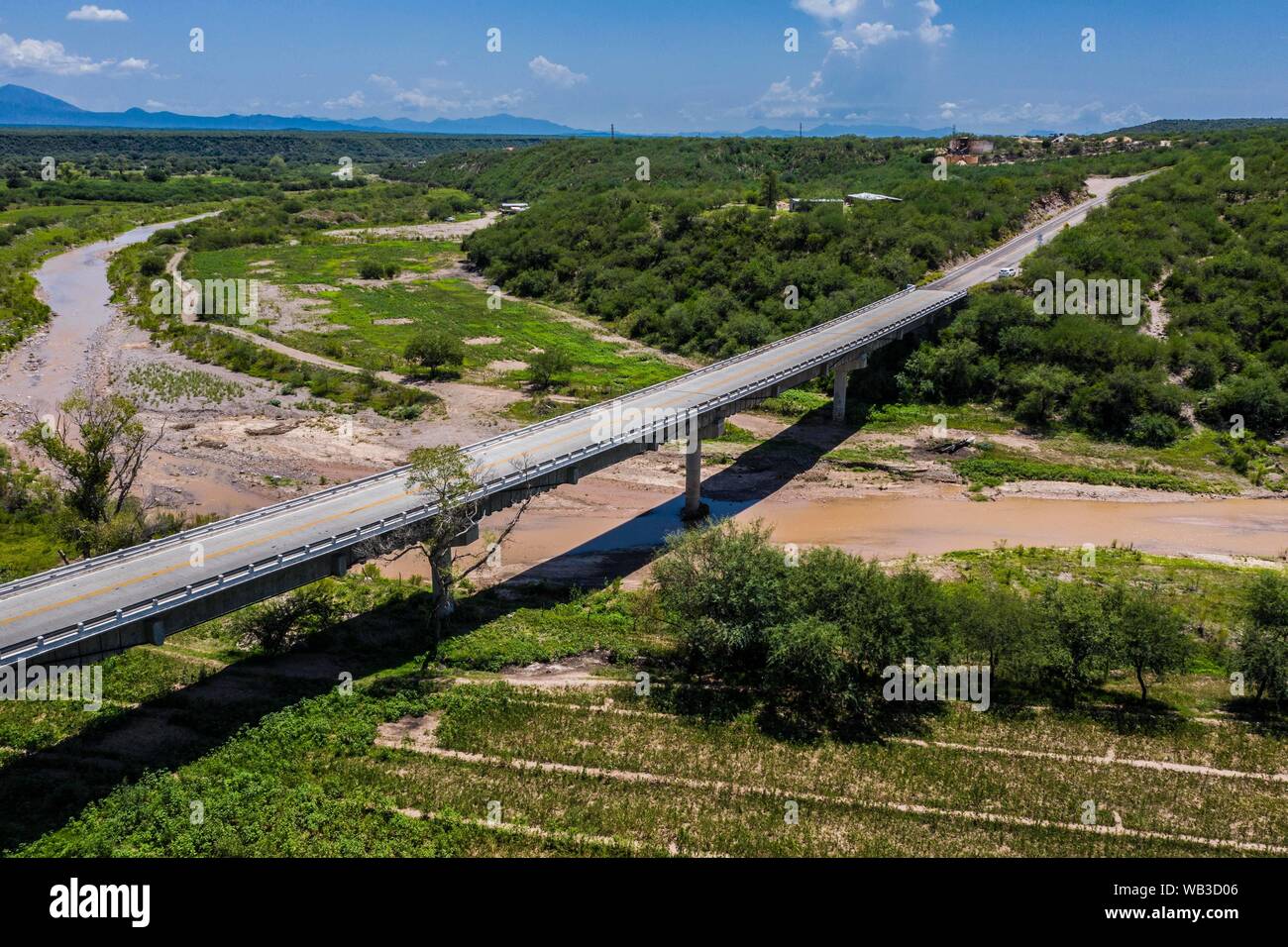 Aerial view of the bridge and road that crosses the river. Entry and ...