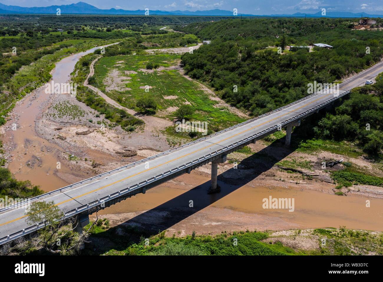 Aerial view of the bridge and road that crosses the river. Entry and ...