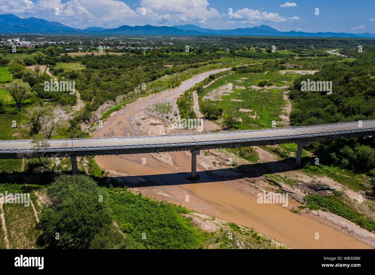 Aerial view of the bridge and road that crosses the river. Entry and ...