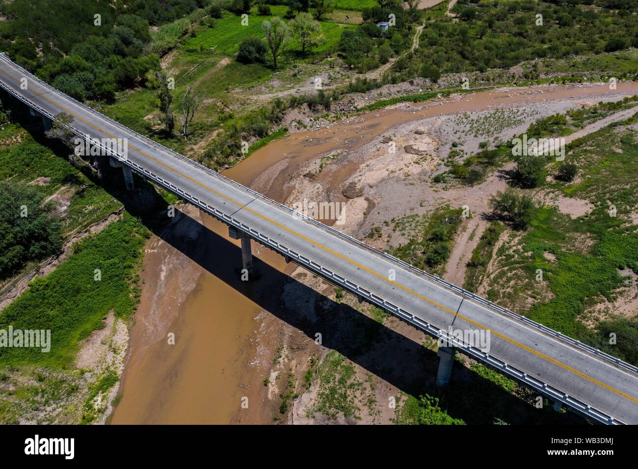 Aerial view of the bridge and road that crosses the river. Entry and ...