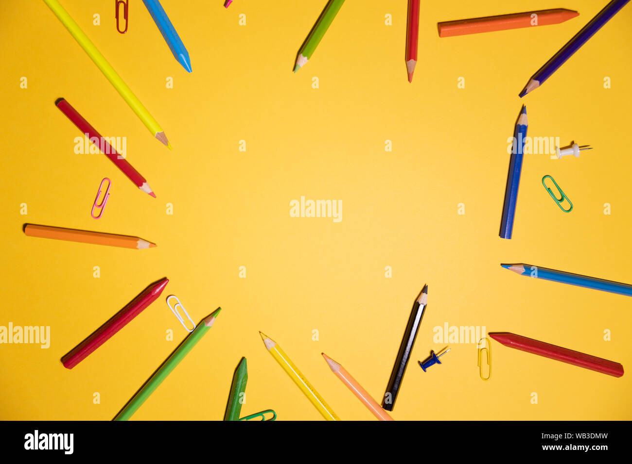 School supplies on yellow board background. Education, back to school ...