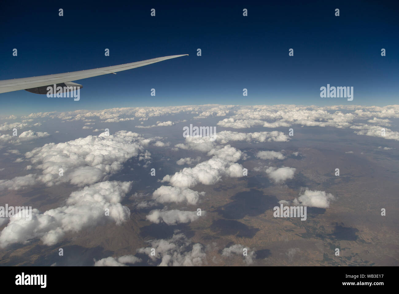 Airplane Wing and Clouds Viewed from Inside the Aircraft. Travel ...