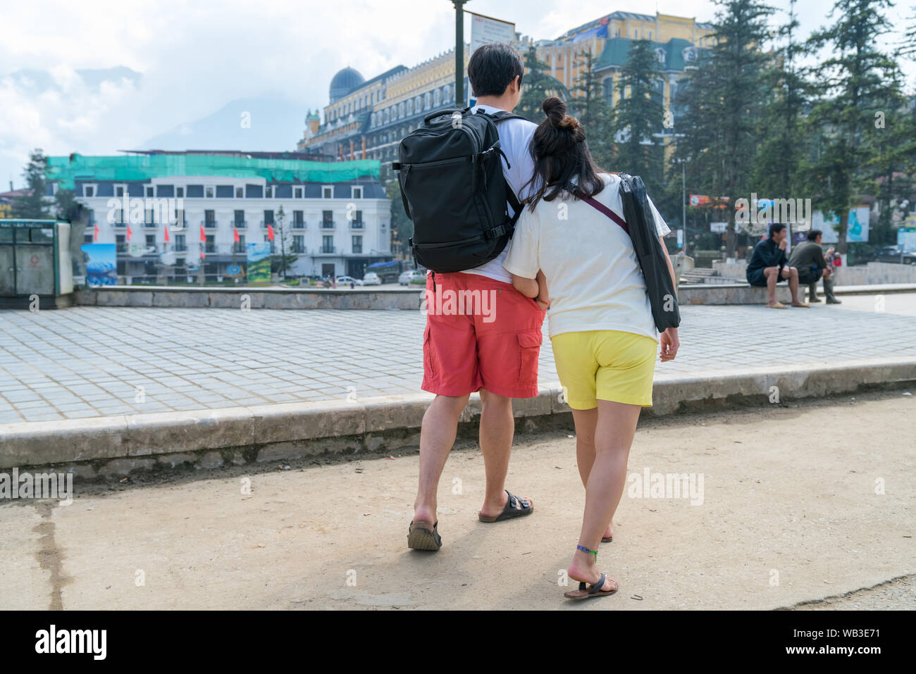 Happy couple hold hands walking in Sapa, Vietnam. Travel vacation ...