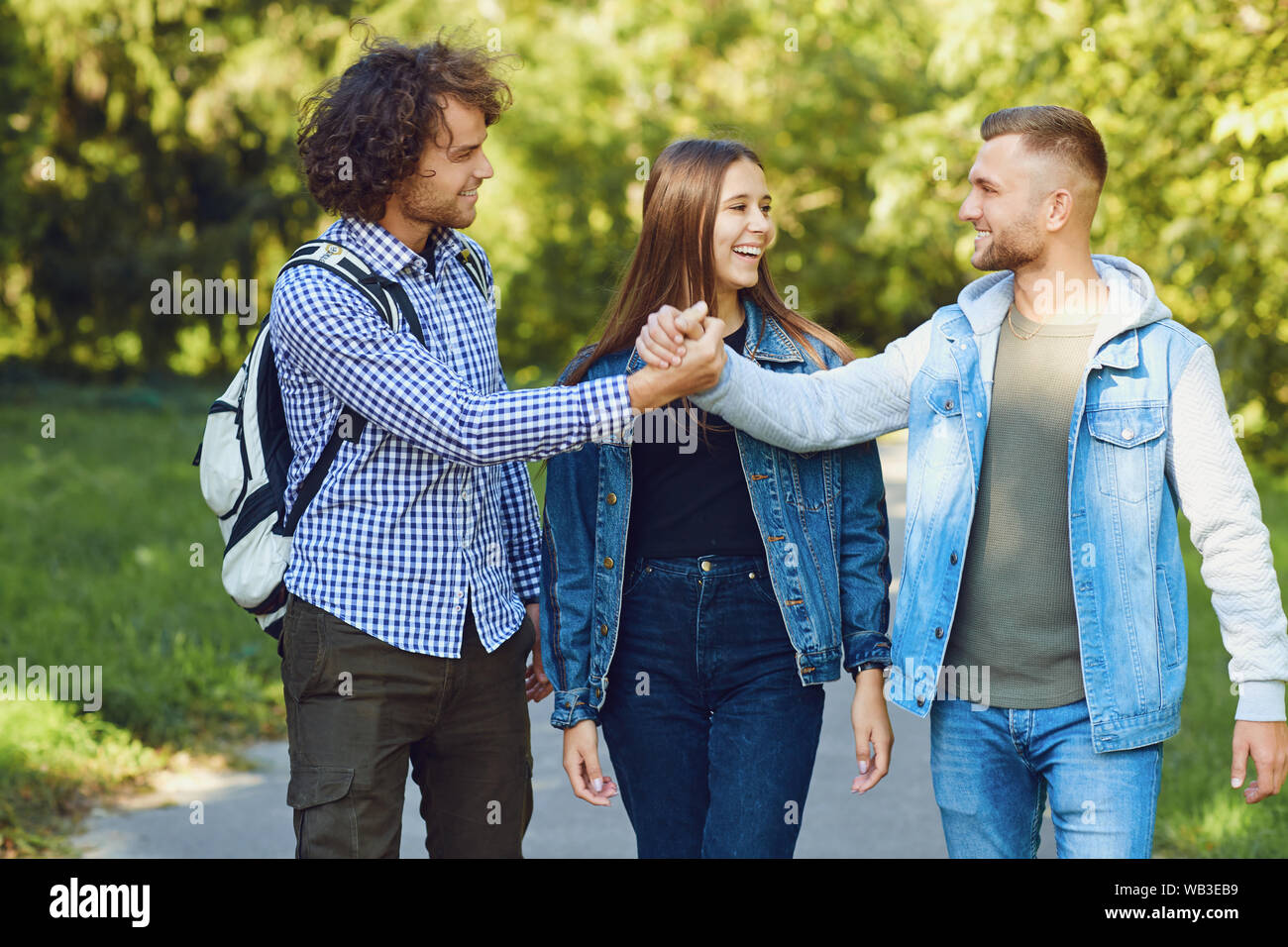 Happy friends are laughing at the park Stock Photo - Alamy