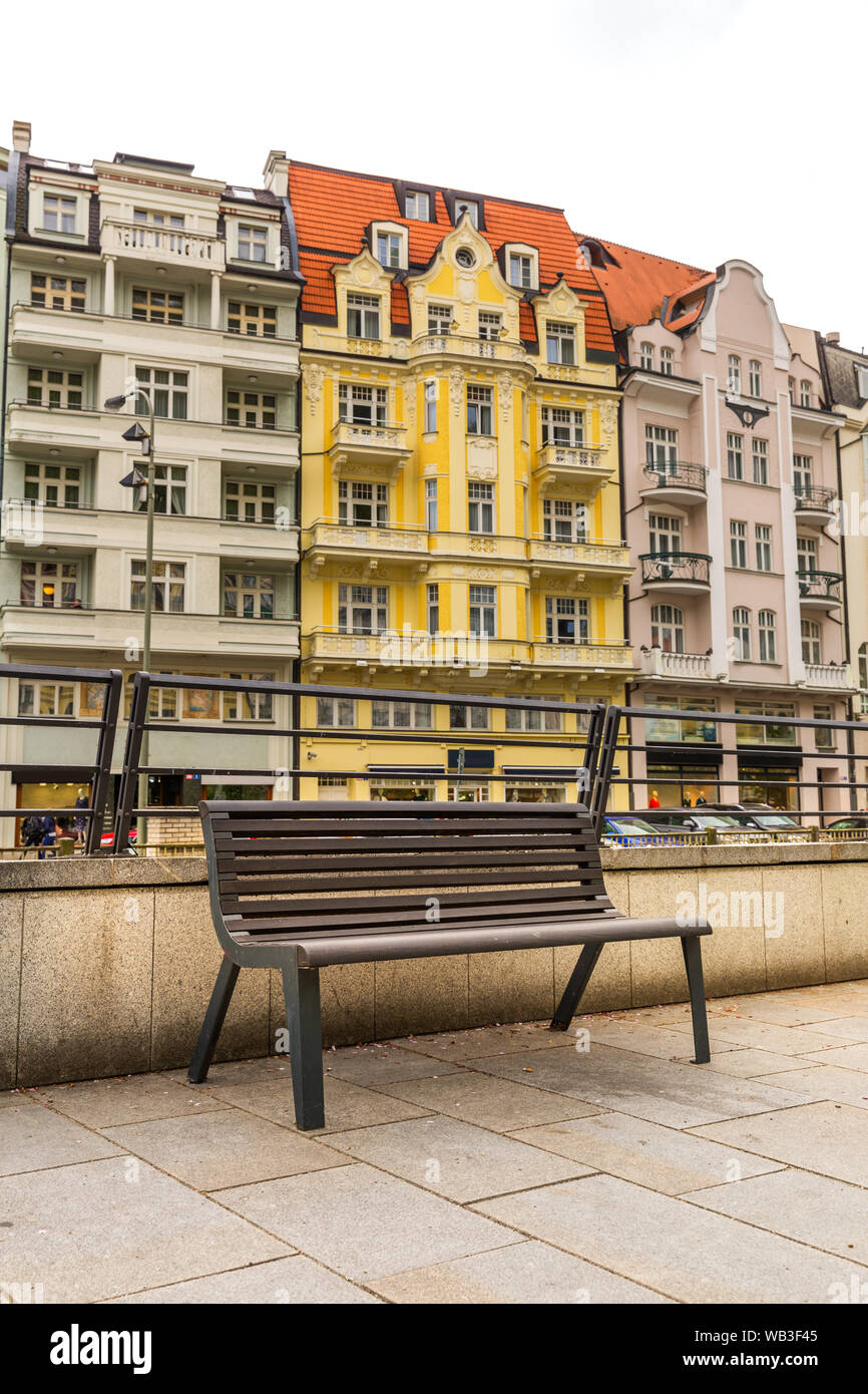 Bench on street with granite tiles, Karlovy Vary Stock Photo - Alamy