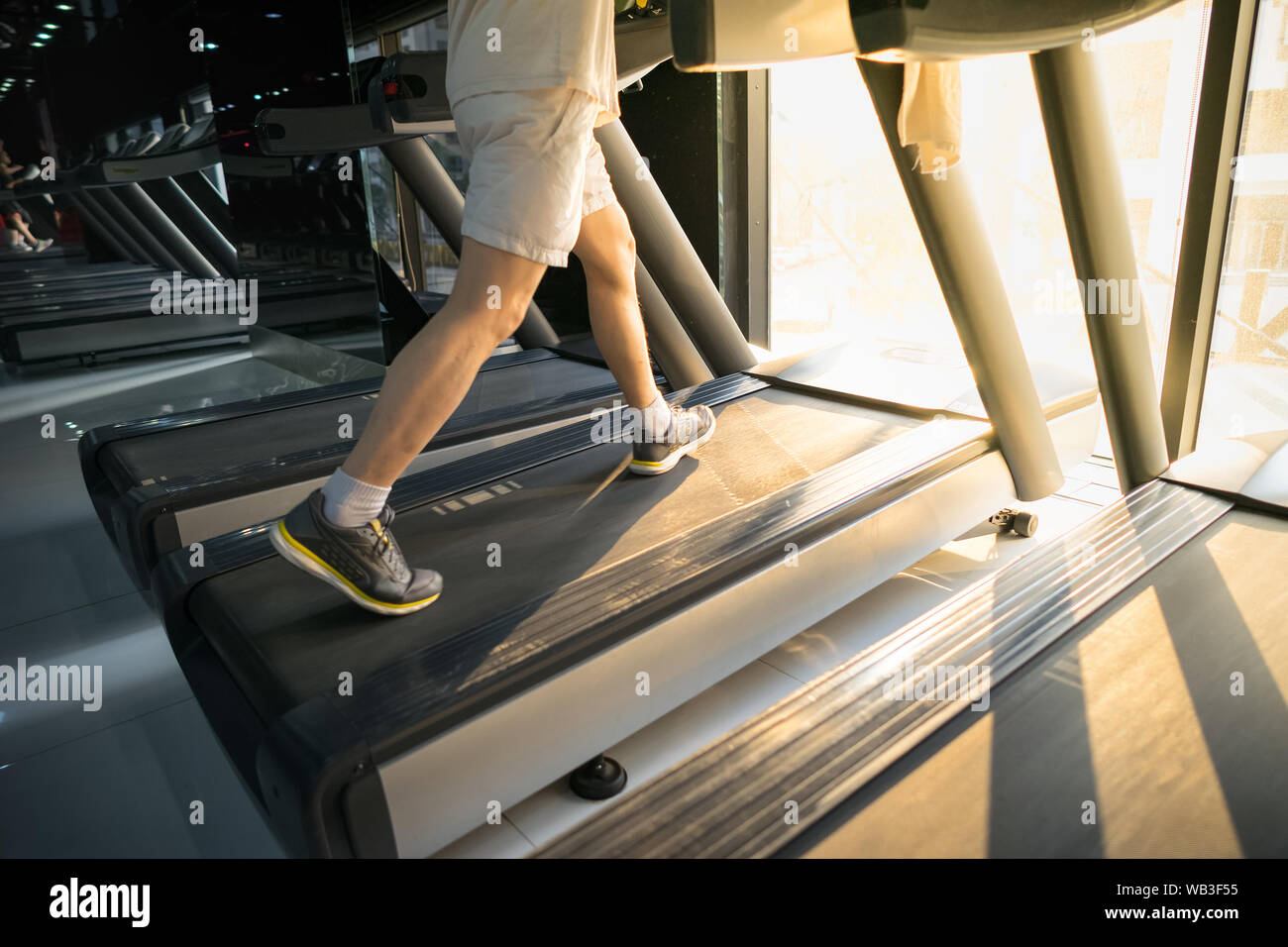 Machine treadmill with people running closeup at fitness gym Stock ...