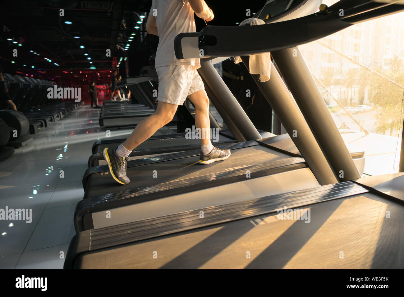 Machine treadmill with people running closeup at fitness gym Stock ...