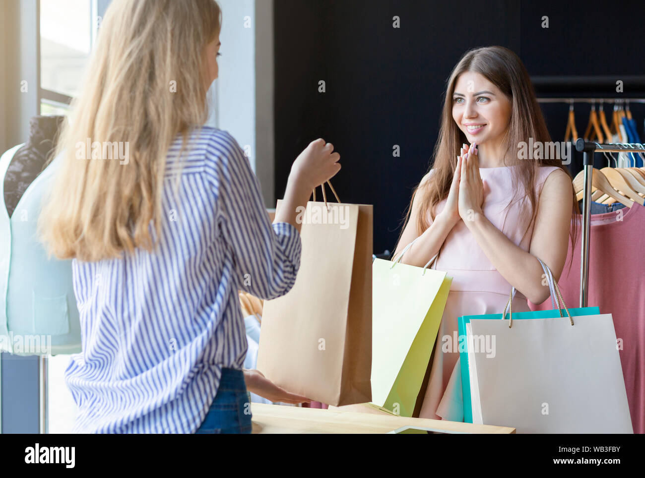 Attractive shop assistant hi-res stock photography and images - Alamy