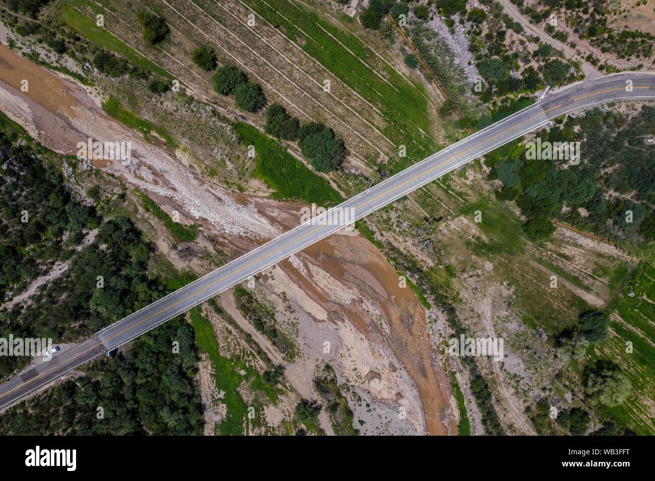 Aerial view of the bridge and road that crosses the river. Entry and ...