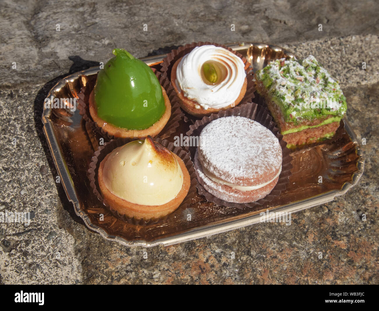 tray with delicious cream pastries Stock Photo - Alamy
