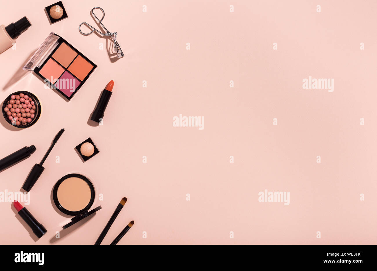 Different luxury make up cosmetics frame on pink background Stock Photo ...