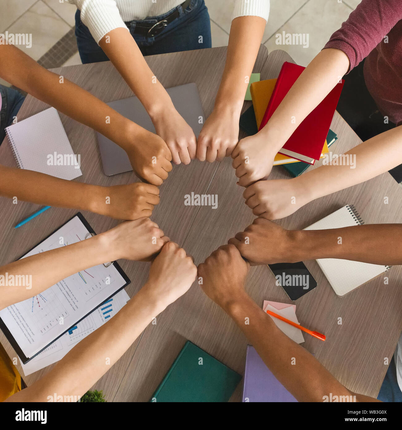 International students joining hands together in cooperation Stock ...